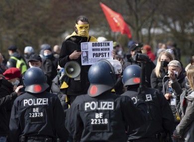 Police clash with protesters as Germany passes law to impose 10pm curfews